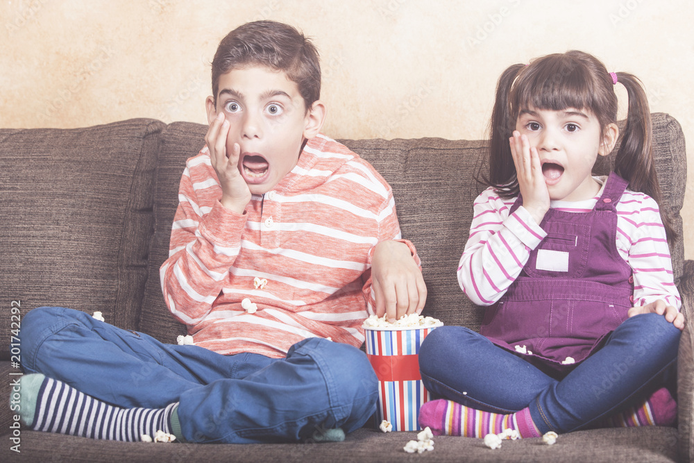 Scared little kids are shocked after watching disturbing or ...