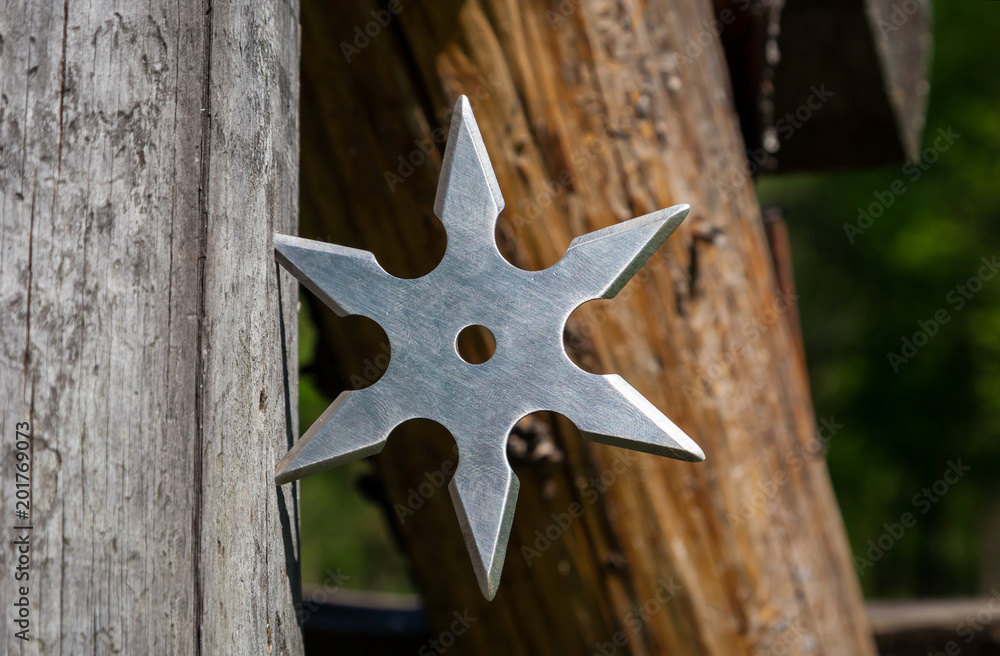 Shuriken (throwing star), traditional japanese ninja cold weapon stuck ...