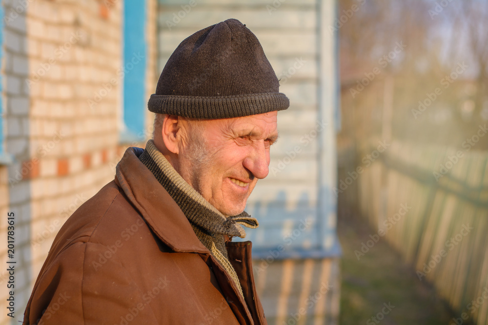 portrait of a tired old man or an elderly grandfather in the background ...