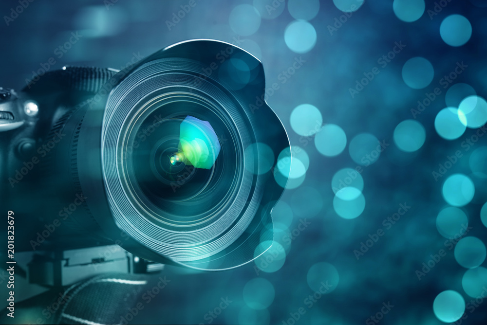Closeup of a digital camera and shiny bokeh background. Stock Photo ...