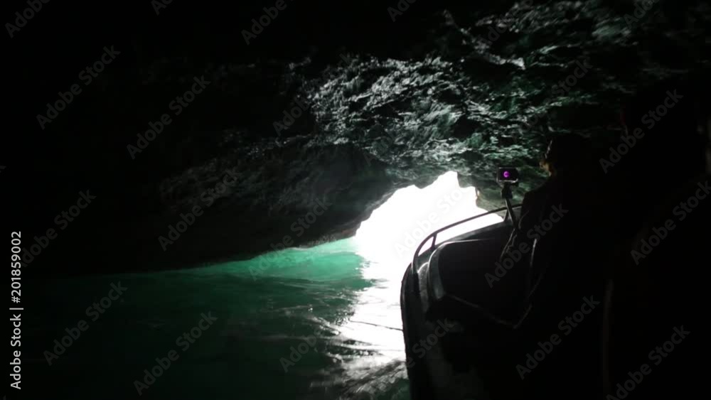 POV in the interior of the Benagil Cave with sailing by boat tour ...