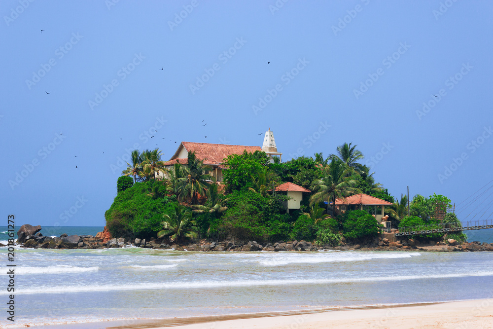 Buddhist island temple in Matara on Pigeon Island. Blue clean sky. Old ...