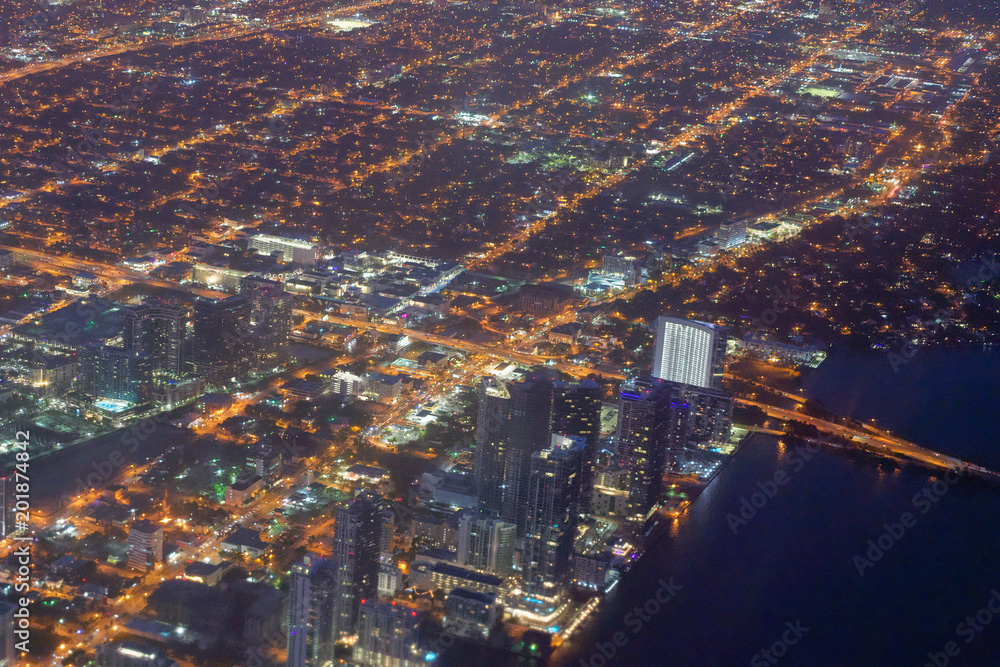 Downtown Miami lights at night from departing aircraft Stock Photo ...