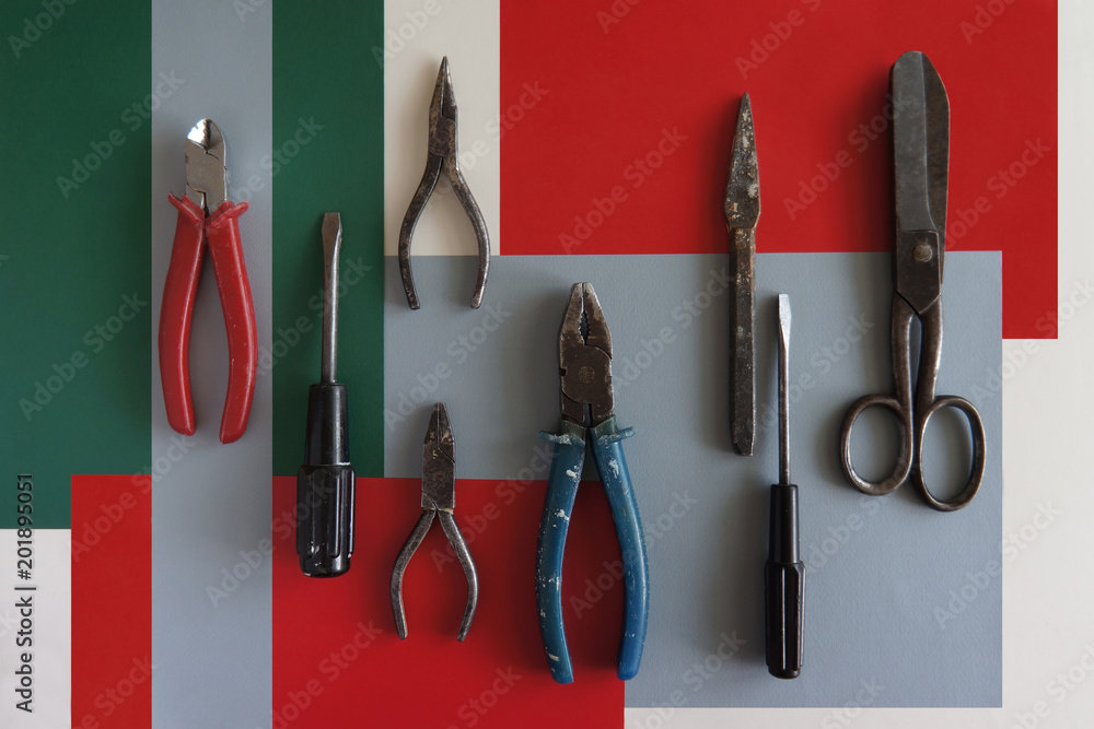 Working tool on constructivism background: screwdriver, pliers, nippers ...