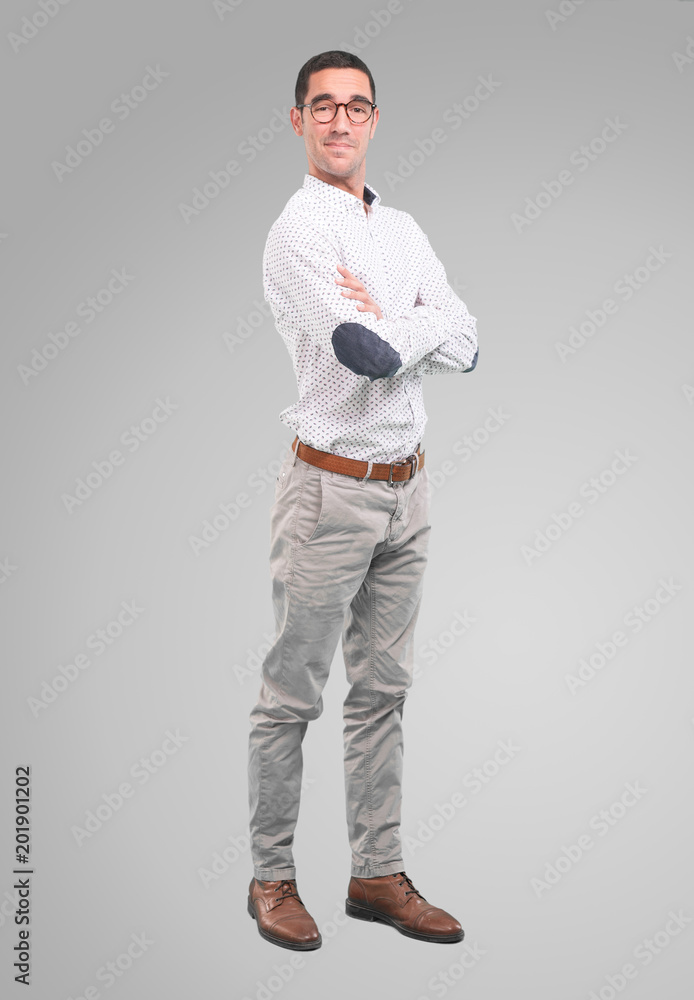 Proud young man with crossed arms gesture - Full body shot Stock Photo ...