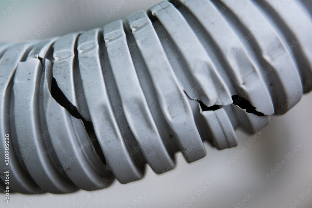 Damaged plastic corrugated hose macro Stock Photo | Adobe Stock