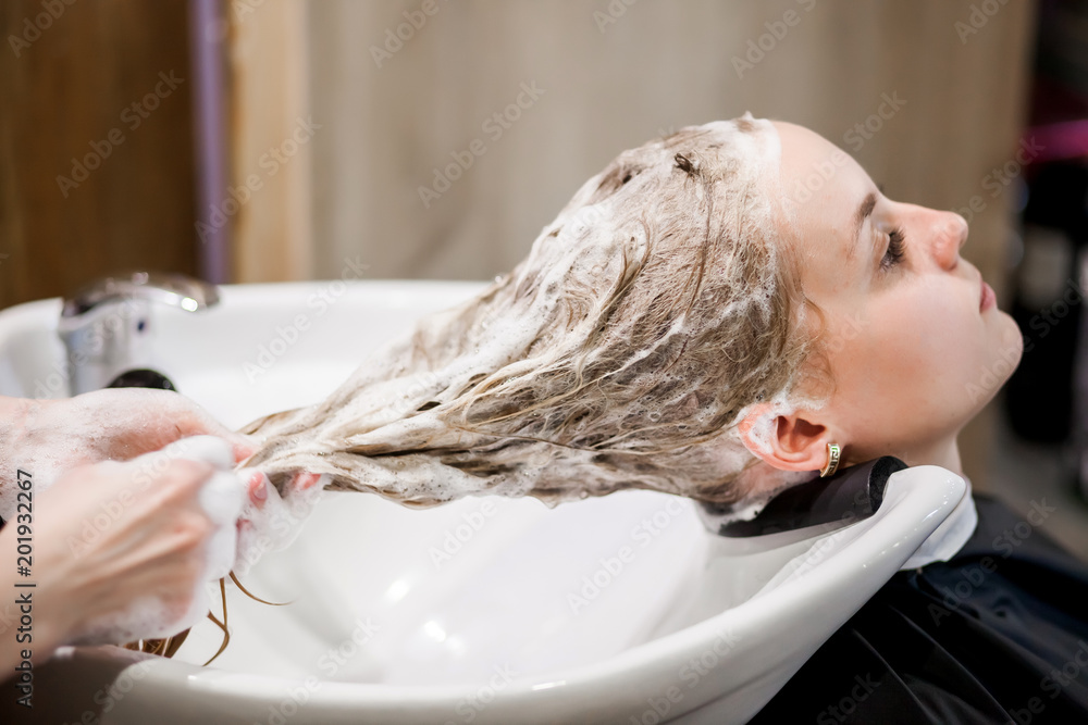 Girls wash their heads in the hair salon Stock Photo | Adobe Stock