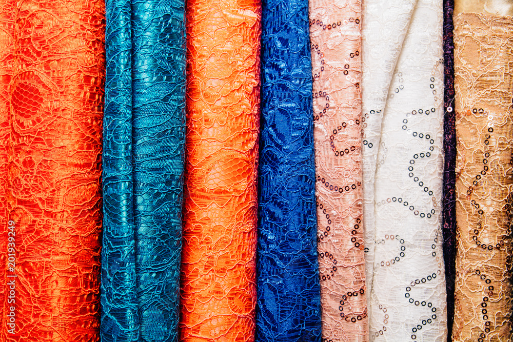 Different types of fabrics are stacked in a row Stock Photo | Adobe Stock