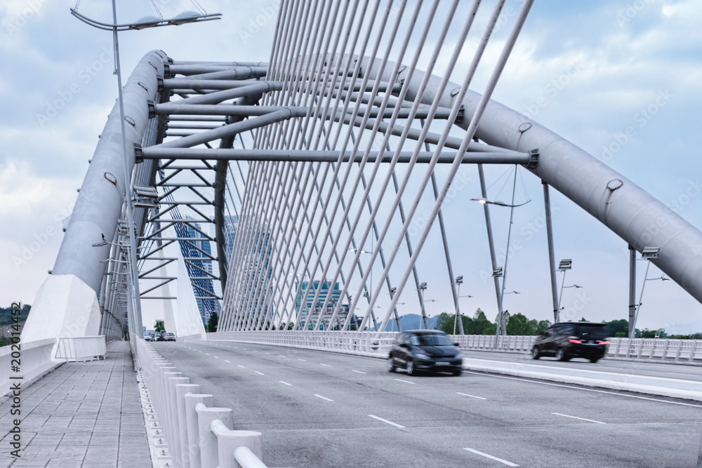 Details of modern architecture - cars moving on road large bridge in ...
