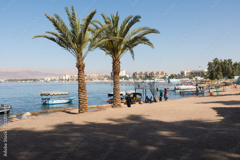 Touristic ships on the beach of Aqaba, Jordan. Popular resort, located ...