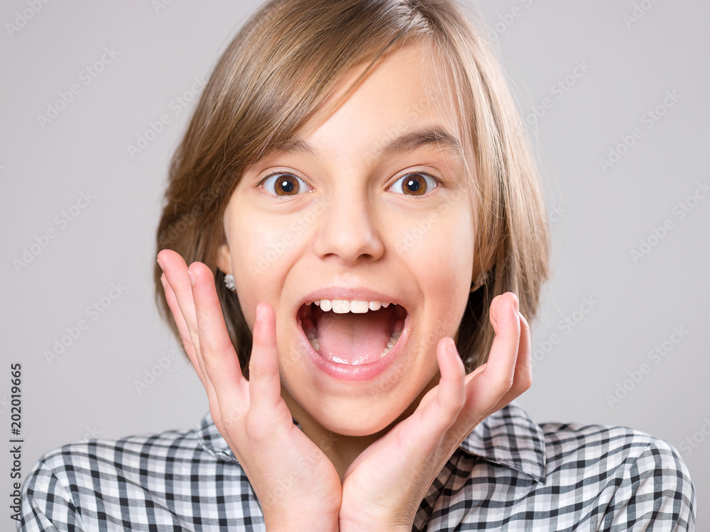 Close-up emotional portrait of excited little girl. Funny cute ...