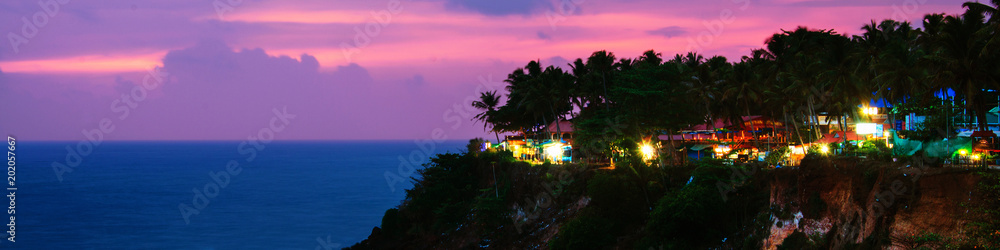 Varkala beach at night, various cafes and restaurants at the cliff in ...