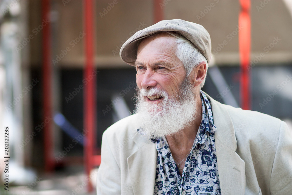 emotions of an expressive gray-haired old man with a beautiful strong ...