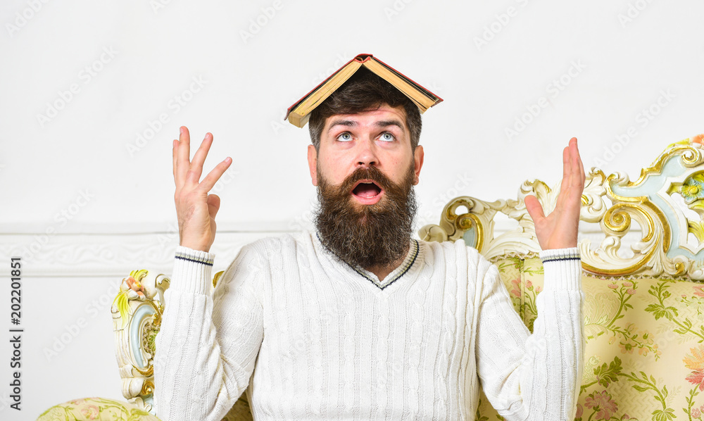 Lose mind concept. Man on crazy face with beard and mustache sits on ...