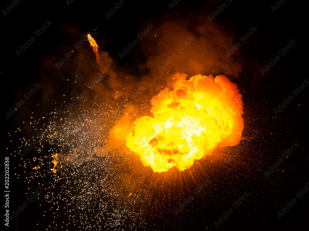 Realistic fiery explosion with sparks over a black background Stock ...
