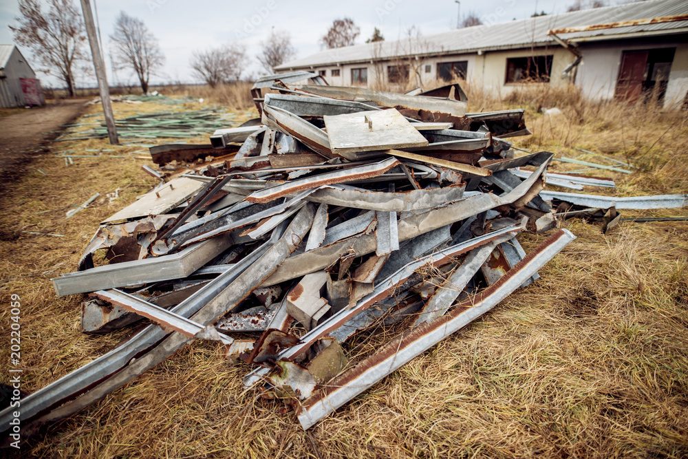 Old forgotten industrial backyard mess and disorder with a bunch of ...