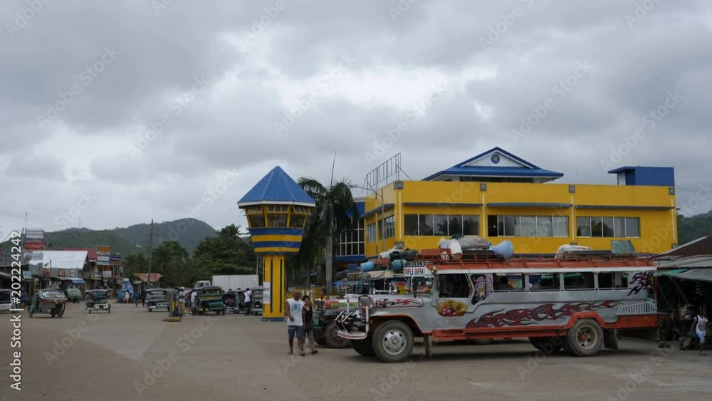 Jeepneys and tricycles at bus terminal Taytay, Palawan, Philippines ...
