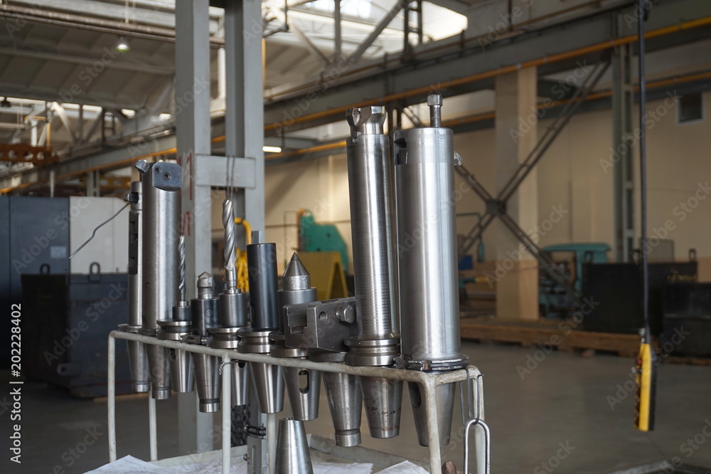 Rack for mandrels with cutters near the cnc machine Stock Photo | Adobe ...