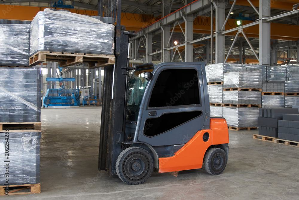 Working Forklift in warehouse. Forklift loader pallet stacker truck ...
