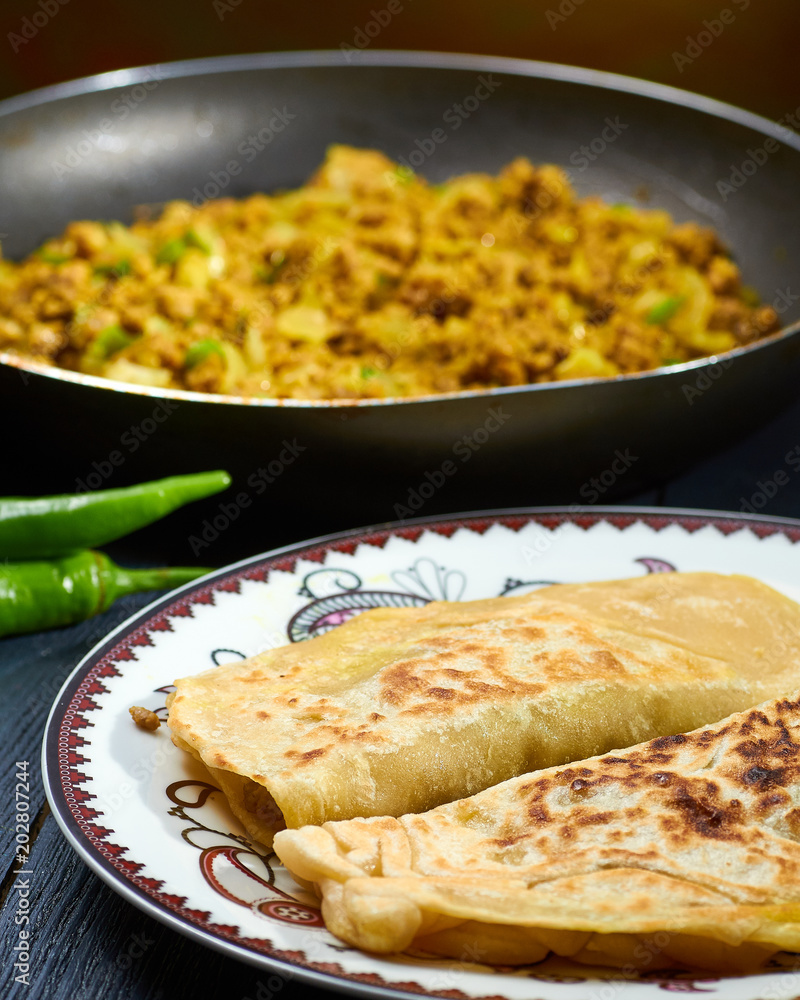Appetizing Arab tortillas with meat. Frying pan with minced meat for ...
