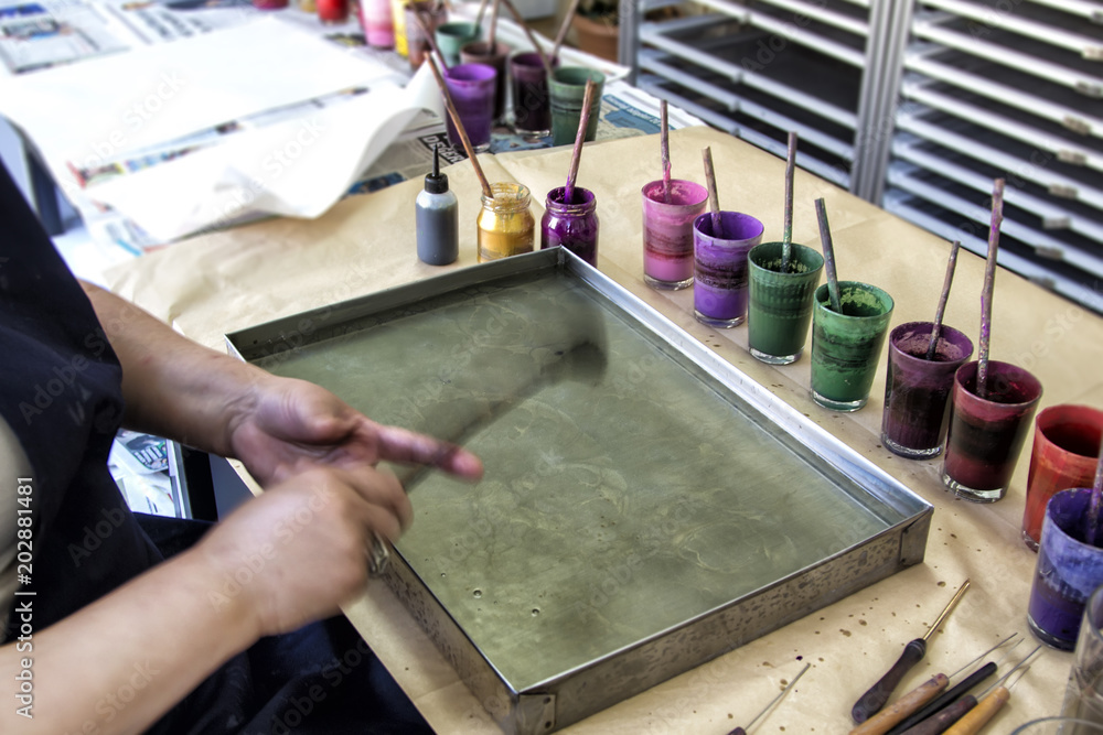 The traditional art of painting on the water. Process of creating ...