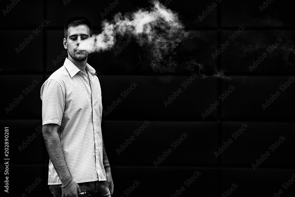 Vape man. Handsome young white guy with modern haircut in in checkered ...