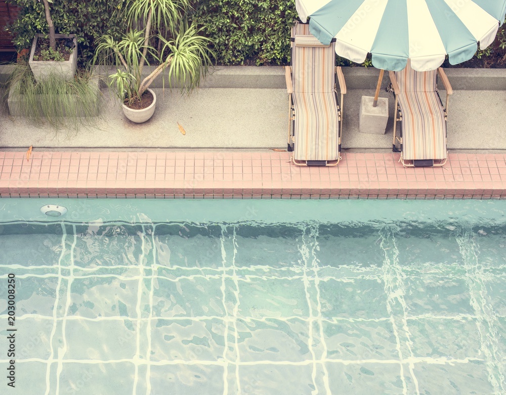Swimming pool in summer time Stock Photo | Adobe Stock