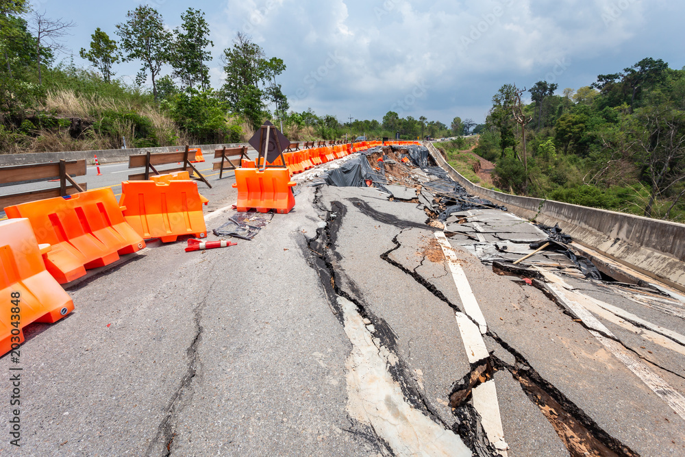 Big damage of asphalt road on the hillside cause of heavy rain and ...