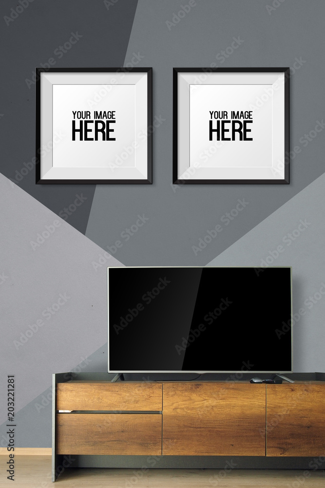 Led TV on TV stand in empty room with picture frame on modern wall ...