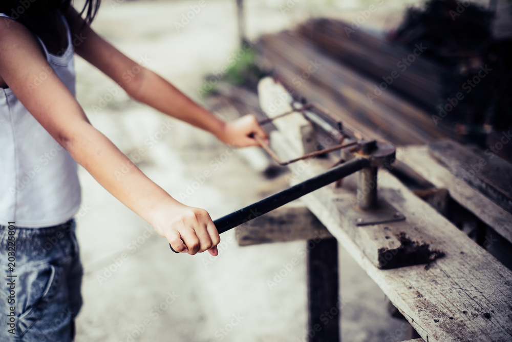 Little girl labor working in commercial building structure, World Day ...