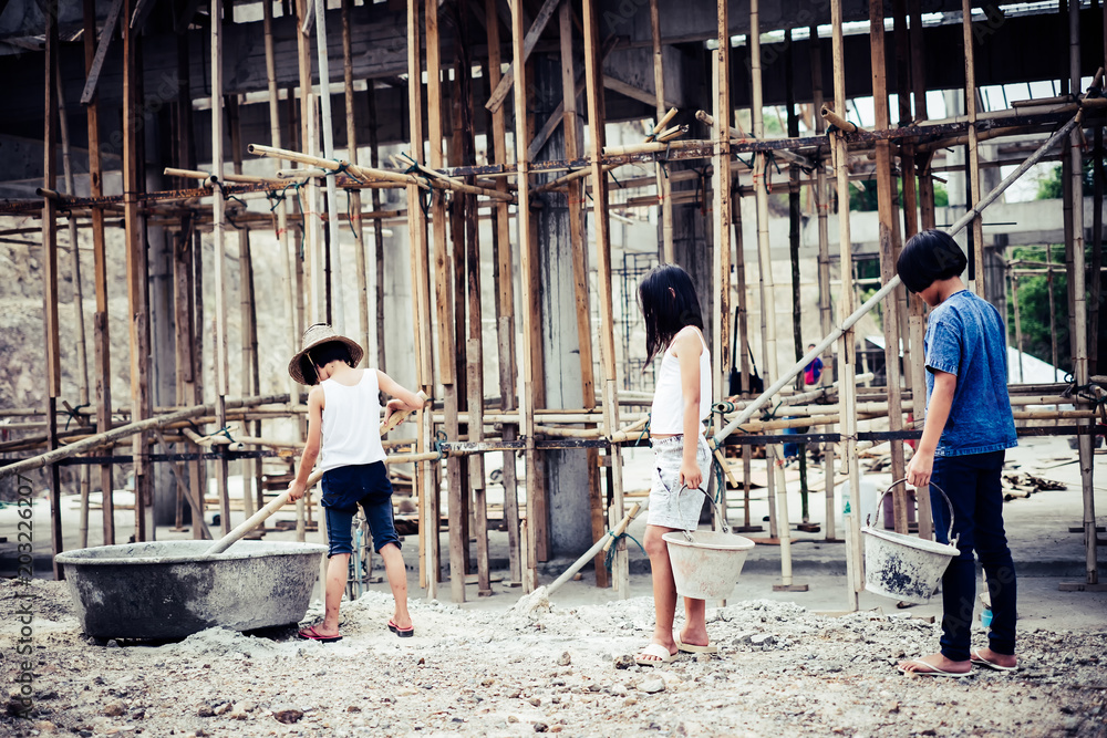 Little girl labor working in commercial building structure, World Day ...