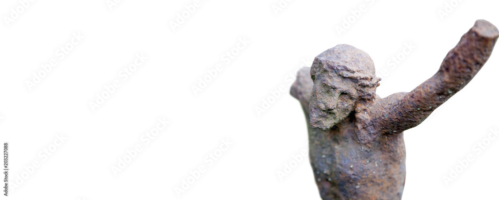 Partially destroyed ancient statue of the crucifixion of Jesus Christ ...