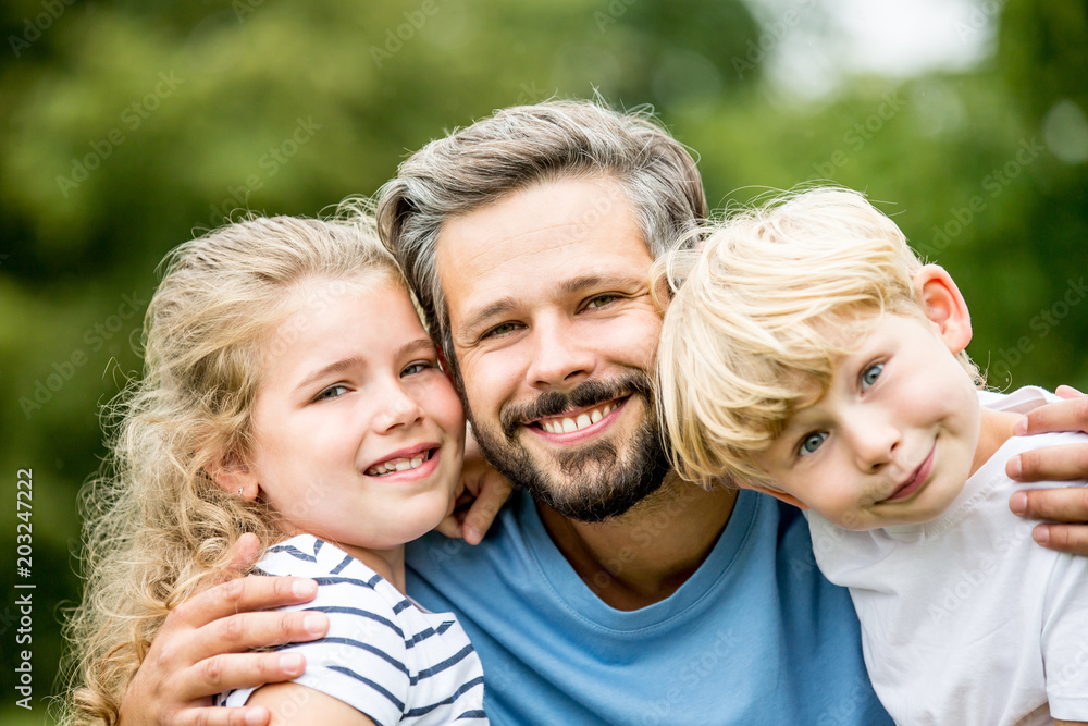 Children with father having fun Stock Photo | Adobe Stock