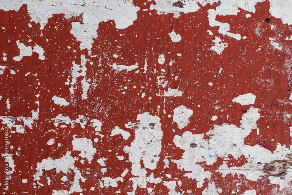 Distressed painted wall texture with red paint stains and white ...