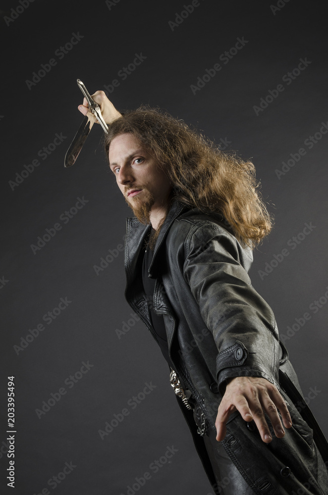 Long hair and beard for a young warrior with a sword Stock Photo ...
