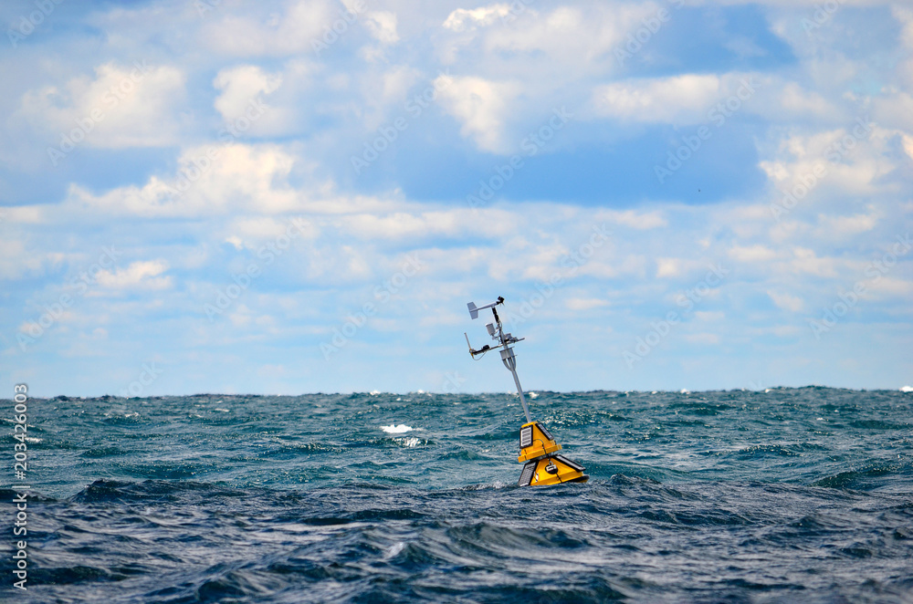 floating weather station buoy on Lake Michigan with horizon background ...