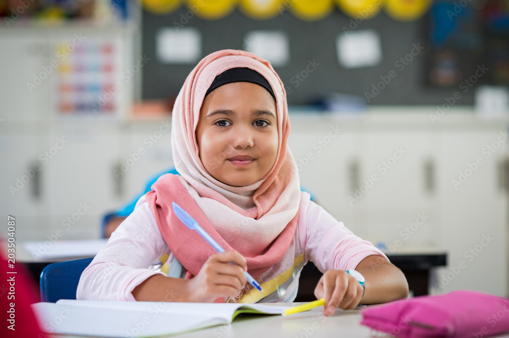 Young girl in hijab at school Stock Photo | Adobe Stock