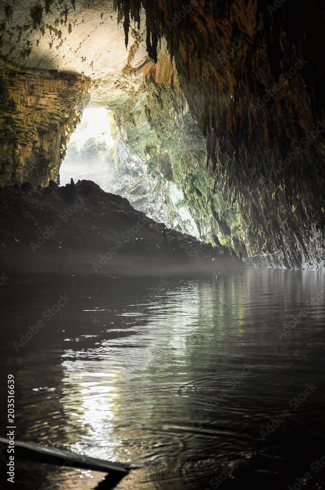 Beautiful scenery of cave lake between stone walls. Scenic, mysterious ...