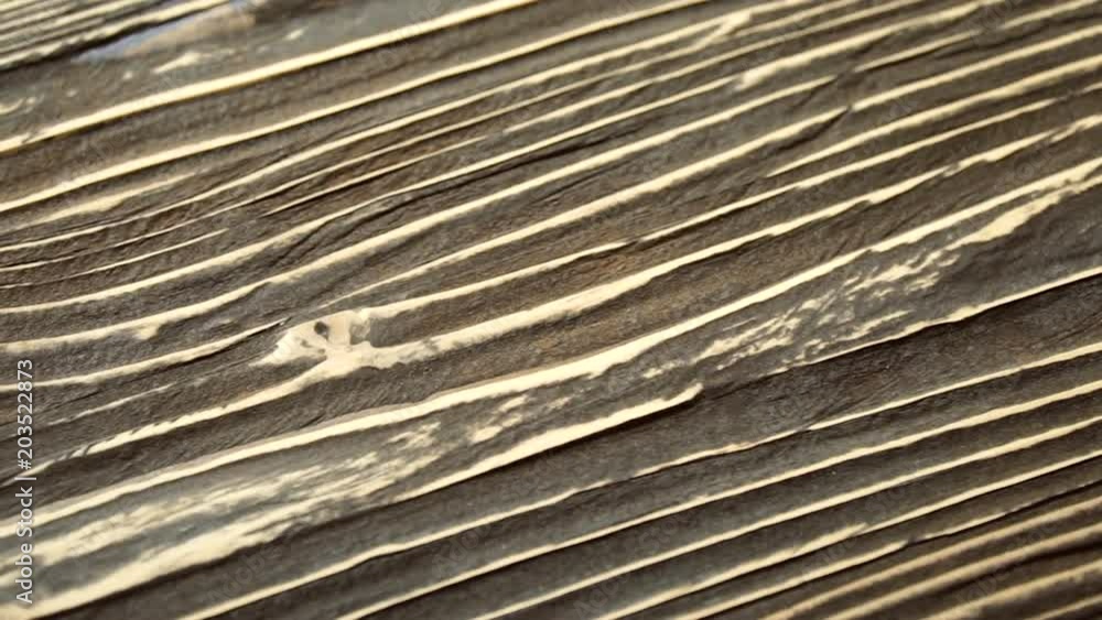 A sliding footage of a beautiful wooden surface texture. May be used ...
