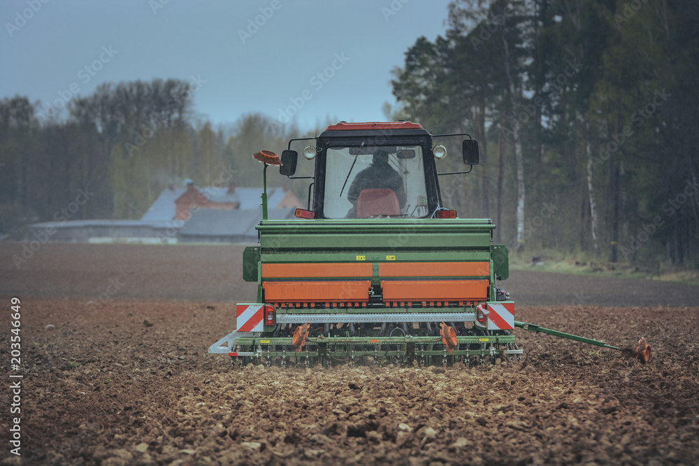 Land being cultivated and prepared for sowing with a tractor. Crispy ...