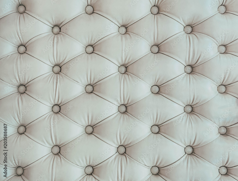 Coach-type screed. Retro light coloured chesterfield style quilted ...