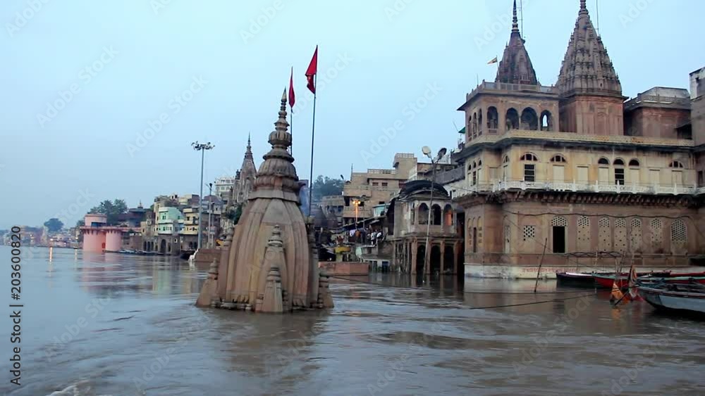 Vidéo Stock Sunrise on boat by Ganges River flooding temples and Ghats ...