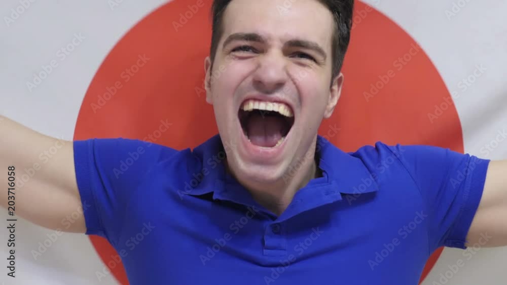 Japanese Young Man Celebrates holding the Flag of Japan in Slow Motion ...
