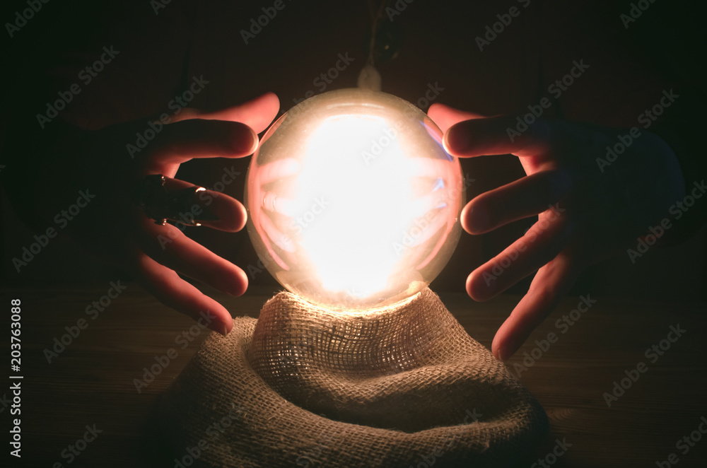 Crystal ball and fortune teller hands. Divination concept. The ...