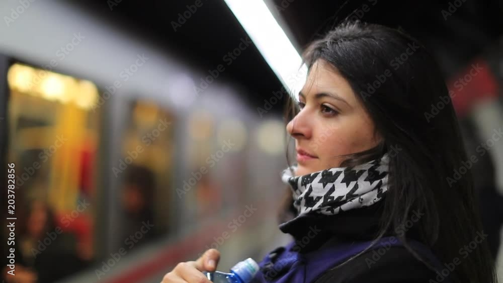 Subway metro arriving on platform. Woman about to embark inside modern ...