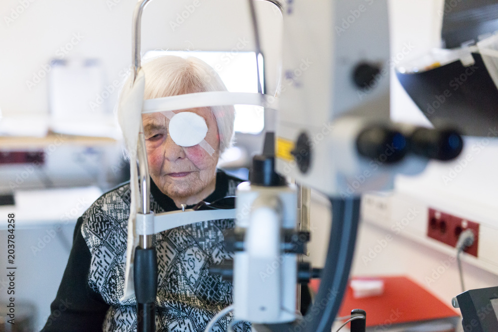 Elderly 95 years old woman wearing eye pathc after laser surgery ...