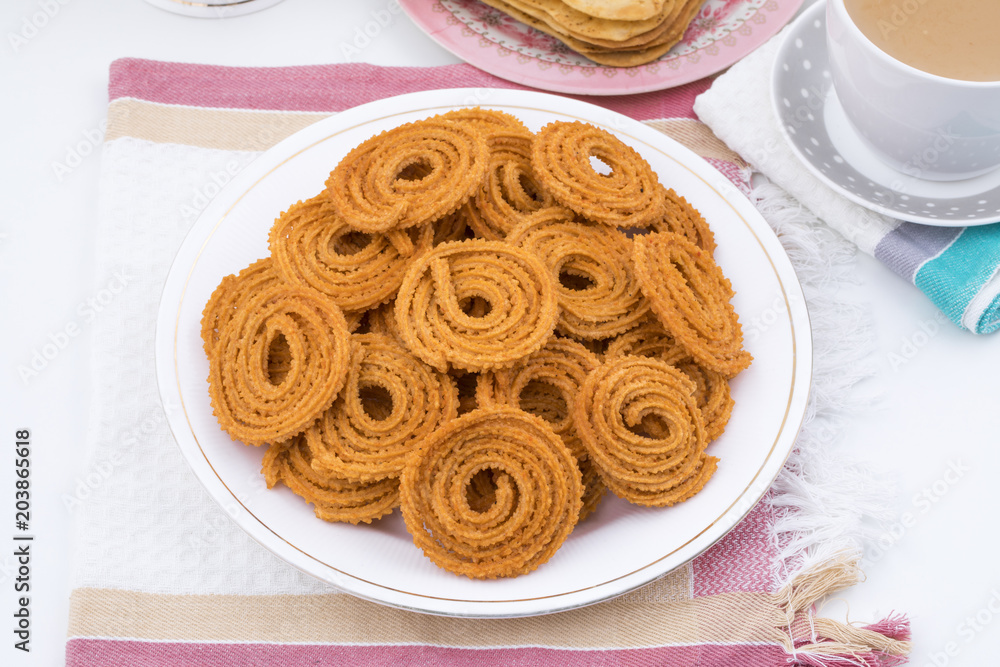 Indian Traditional Snack Chakli, a spiral shaped crisp deep fried snack ...