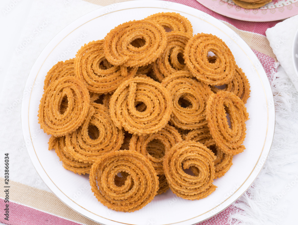 Indian Traditional Snack Chakli, a spiral shaped crisp deep fried snack ...