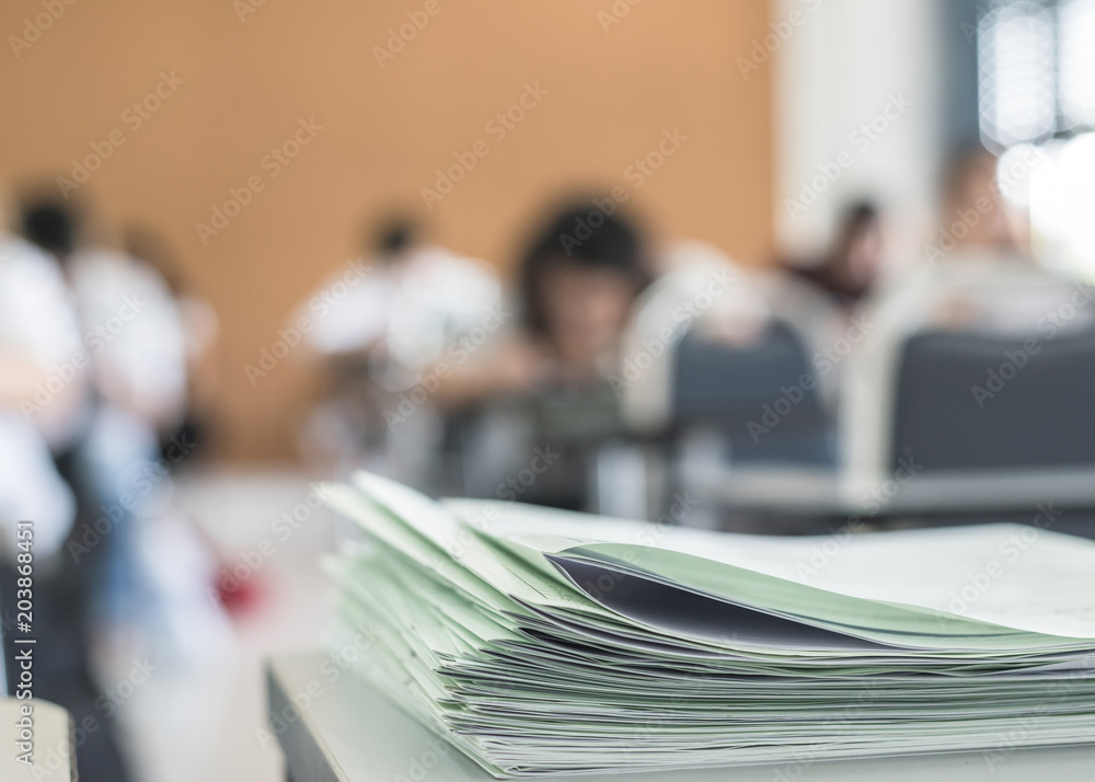 Exam answer sheet or application paper blurry view on table in ...
