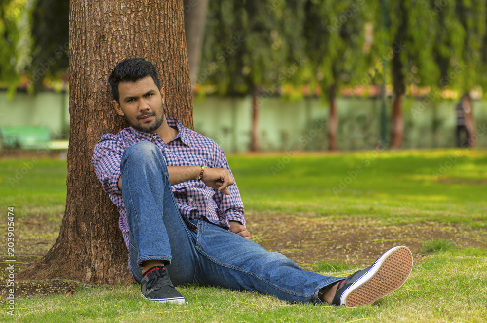 Person Leaning Against A Tree